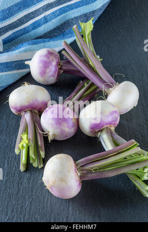 Mini Turnips on a slate background Stock Photo - Alamy