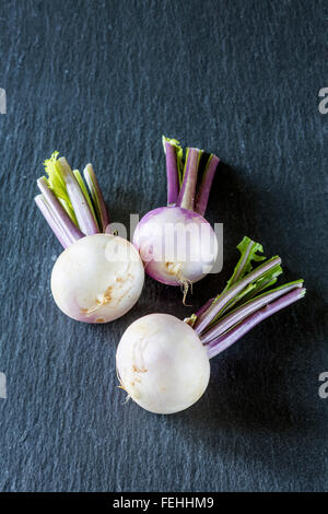 Mini Turnips on a slate background Stock Photo - Alamy