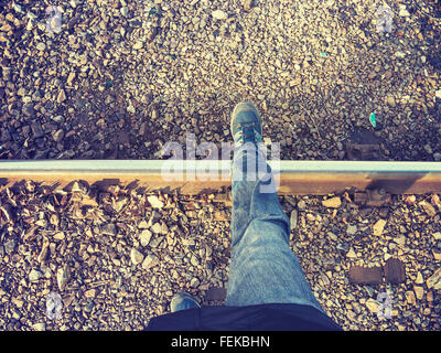 Vintage stylized legs walking on rail track, concept picture Stock ...