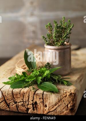 Variety of fresh organic herbs on wooden background. Freshly harvested ...