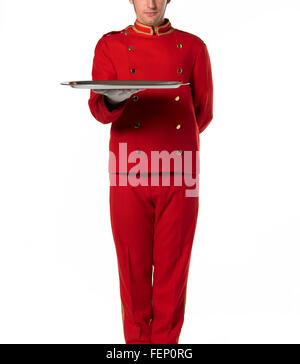 Bellboy holding bell in hotel on his hand Stock Photo - Alamy
