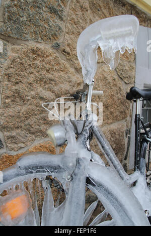 Frozen bike covered with ice. Frozen bike in the middle of wintry ...