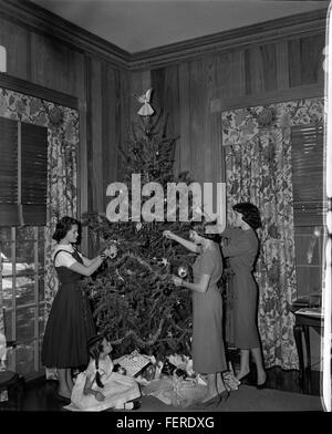 Mary Call Darby Collins and her daughters are seen decorating a ...