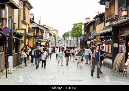 Hanami-koji Street , Kyoto , Japan. A tourist photographs a woman ...