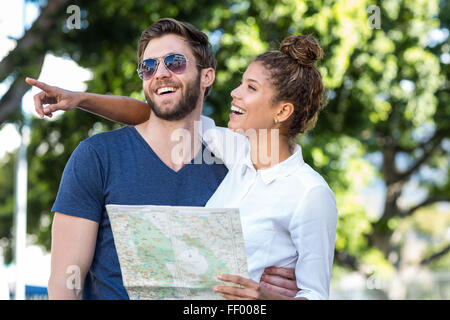 Happy woman pointing to friend with glasses of beer at counter Stock ...