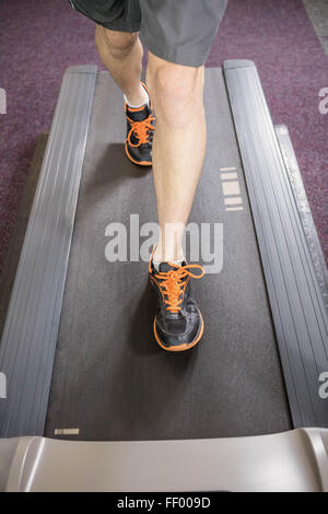Muscle man running on treadmill Stock Photo - Alamy