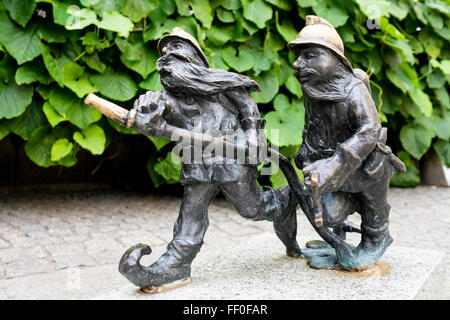 Two of the many famous gnomes and dwarfs spread around the Polish city ...