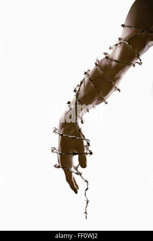 A vertical shot of a Caucasian male with arm tattoos and a buzz cut ...