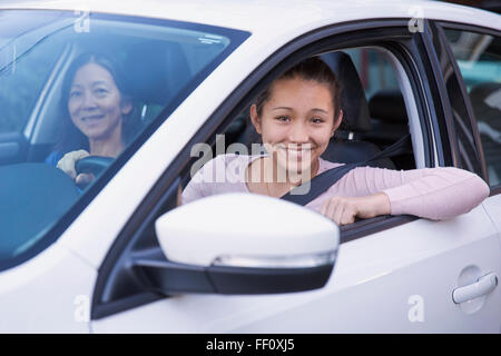 Mother teaching her daughter how to drive Stock Photo - Alamy