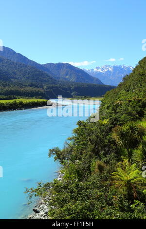 New Zealand landscape. Whataroa River and Southern Alps mountain range ...