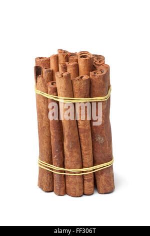 Bunch of cinnamon sticks on a white reflective background. Selective ...