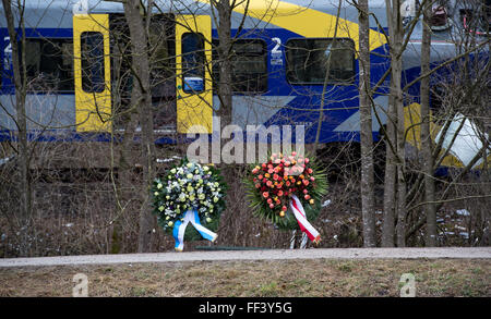 Bad Aibling, Germany. 10th Feb, 2016. Firefighters stand at the site of ...