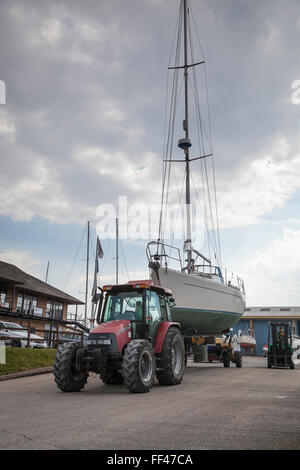 Tractor towing a large boat trailer Stock Photo - Alamy