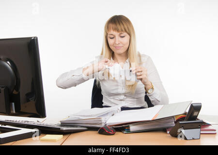 Business woman tearing paper document Stock Photo - Alamy
