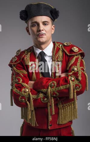 Studio shot of man dressed as Spanish torero, matador, bullfighter ...