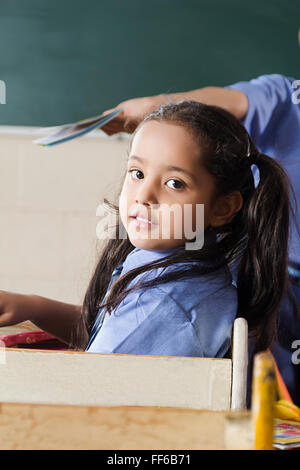 Kid with ponytails colors. Girl with smiling face stands Stock Photo ...
