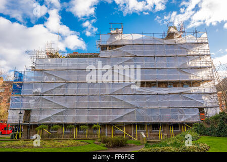 Scaffold with plastic sheet covering erected on a building Stock Photo ...