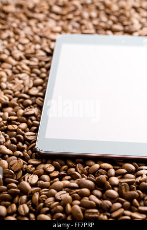 computer tablet on coffee beans Stock Photo - Alamy