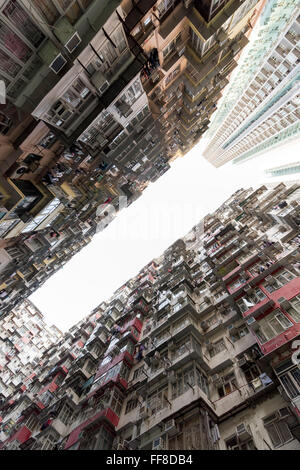 crowded building at night in Hong Kong Stock Photo - Alamy
