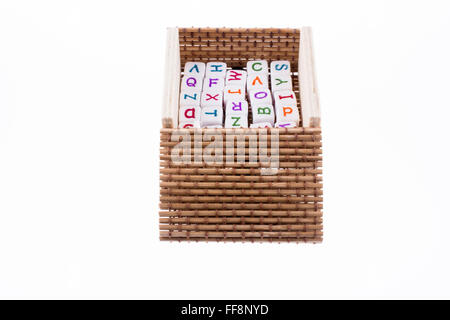 Letter cubes placed in a box on a white background Stock Photo - Alamy