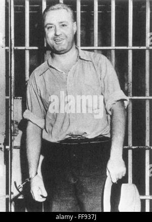George 'Machine Gun' Kelly (1897-1954), handcuffed, shackled, under ...