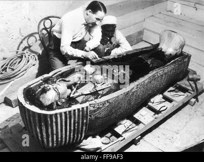 HOWARD CARTER (1873-1939). /nEnglish archaeologist. In the tomb of King ...