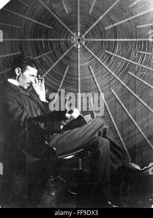 Nikola Tesla (1856-1943), Croatian inventor holding balls of flame in ...