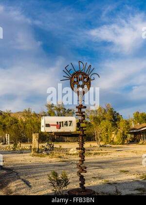A clever metal welded sign with an address on it advertising a welder's ...