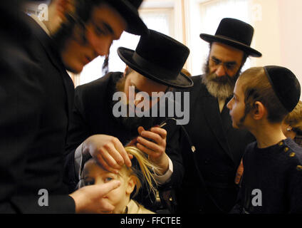 3 Jew Hasidic boys, a family of Jews, in traditional black clothes ...