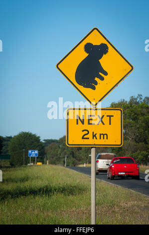 Koala bear crossing warning road sign Stock Photo - Alamy