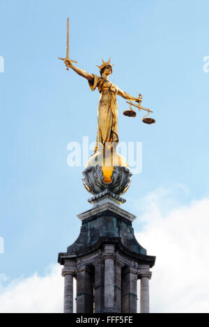 The golden statue of "Lady Justice" on top of the dome of the Central ...