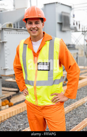 Portrait of young happy engineer in control room in factory Stock Photo ...