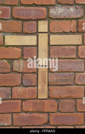 A red brick wall in a cross bracing executed as a half-timbered ...
