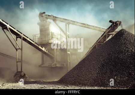 Industrial background with working gravel crusher Stock Photo - Alamy
