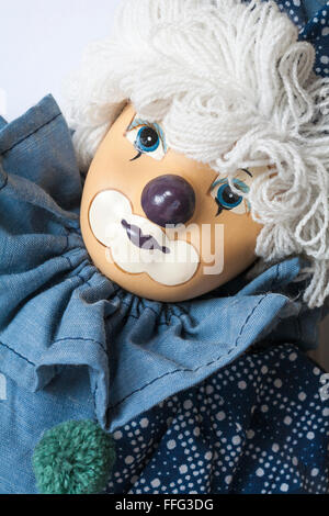 Vintage sad clown puppet on blurred background. Toned photo Stock Photo ...
