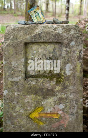 End of Saint James Way sign and lighthouse of Finisterre in Galicia ...