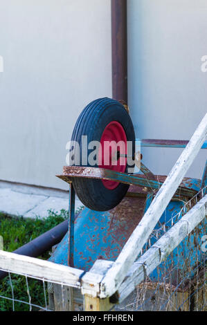 Wheel barrow overturned Stock Photo - Alamy