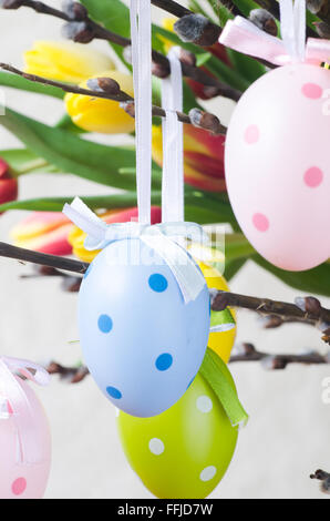 Composition with white tulips and Easter eggs on wooden background ...