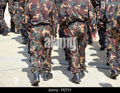 Side View Of Marching Armed Men Formation, Participants Of Parade ...