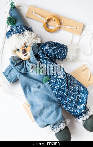Vintage sad clown puppet on blurred background. Toned photo Stock Photo ...