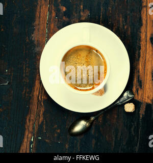 Coffee cup on wooden table - close up studio shoot Stock Photo - Alamy