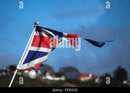 ripped union jack flag on pole Stock Photo - Alamy