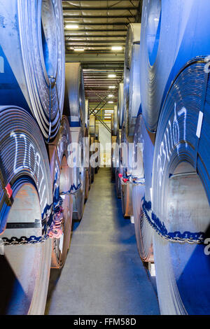 3 master coils on steel chocks in warehouse with coil seen inside eye ...