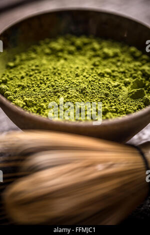 Raw matcha tea powder in wooden bowl. Natural healthy drink Stock Photo ...