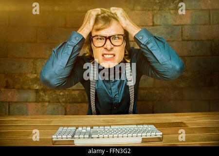 Composite image of angry hipster businessman holding his hairs Stock ...