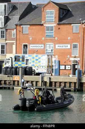 Police boat and officer, Dorset, Britain UK Stock Photo - Alamy