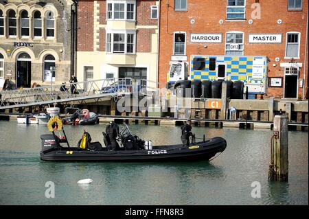 Police boat and officer, Dorset, Britain UK Stock Photo - Alamy