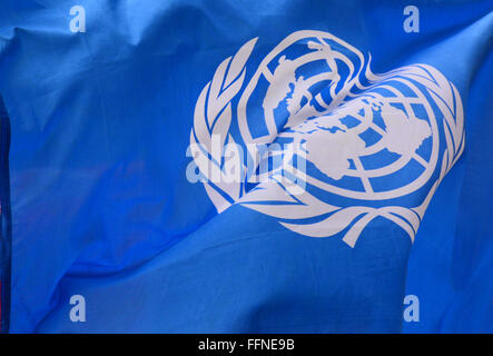 UN flag waving in the wind in front of a blue sky with white clouds ...