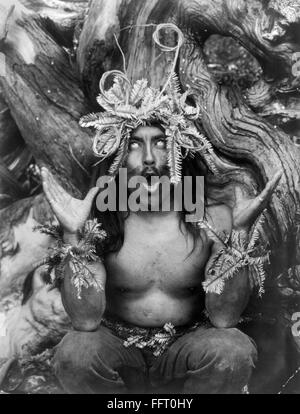 HAMATSA CEREMONY. /nA Kwakiutl man emerging through a wooden dance ...