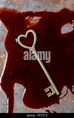 Red heart shaped object in hand as love concept Stock Photo - Alamy